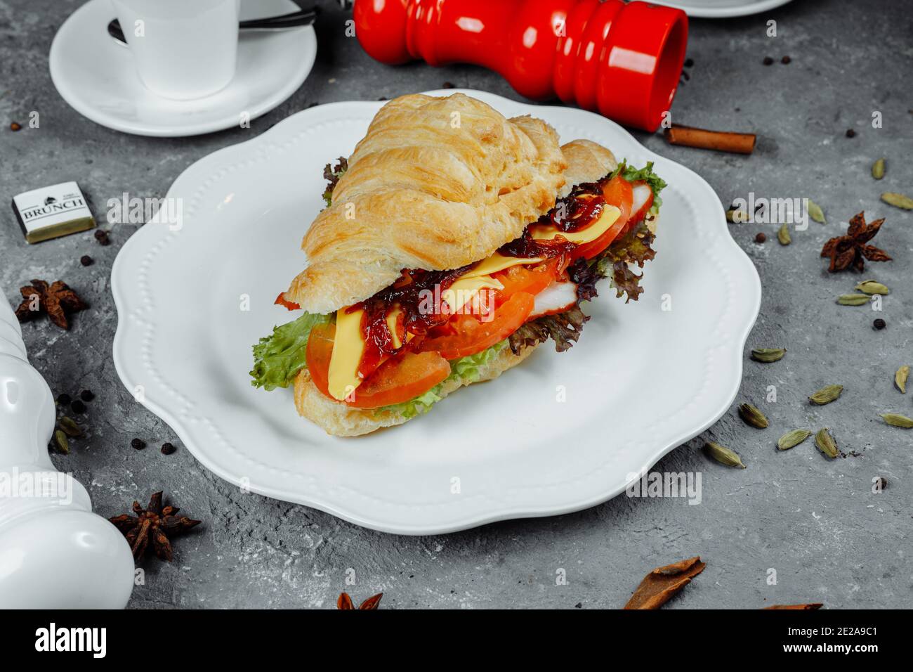Delicious ham and cheddar cheese croissant with salad Stock Photo - Alamy