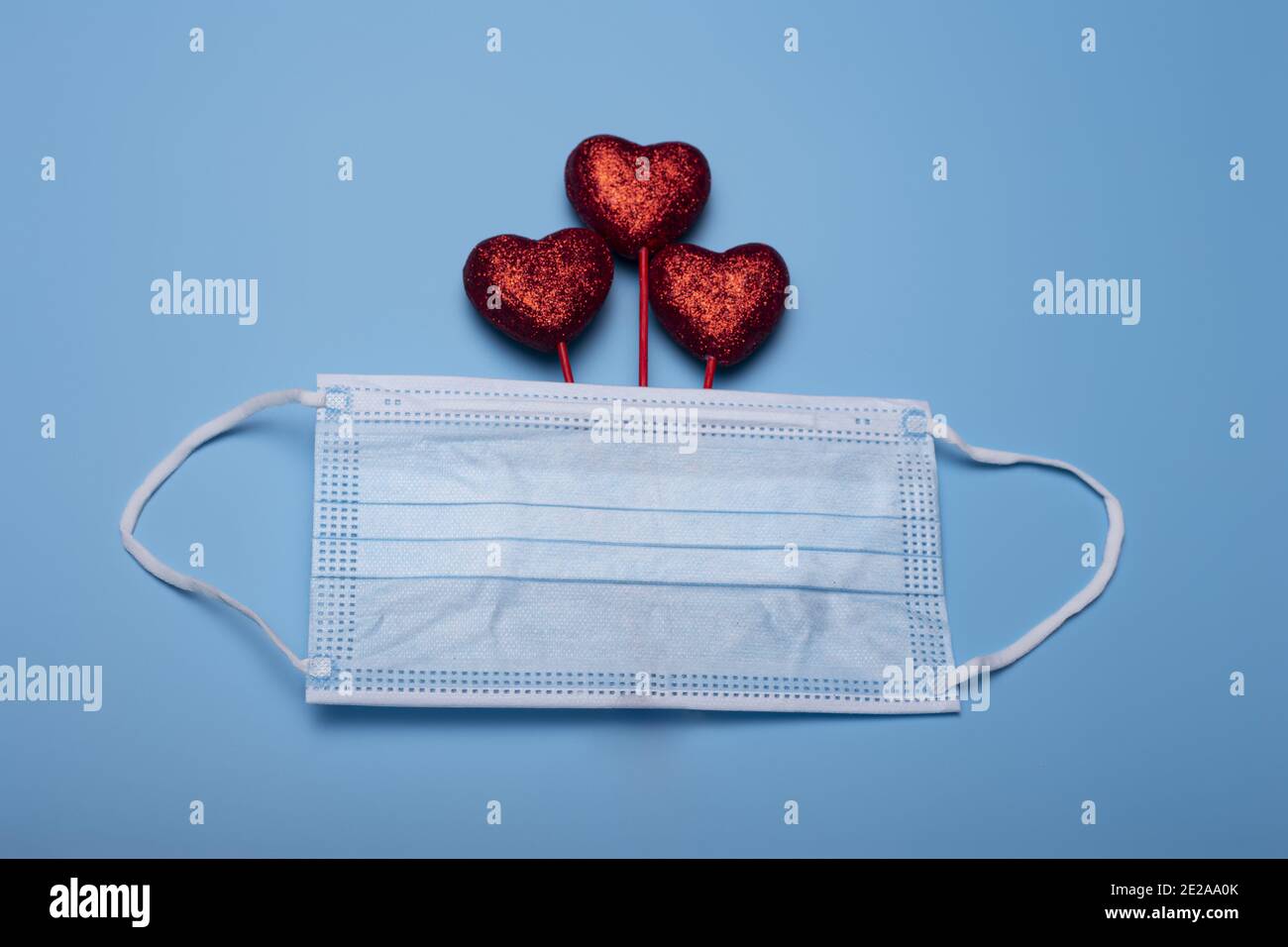 Sanitary mask and small red hearts decorations - Valentine's Day during ...