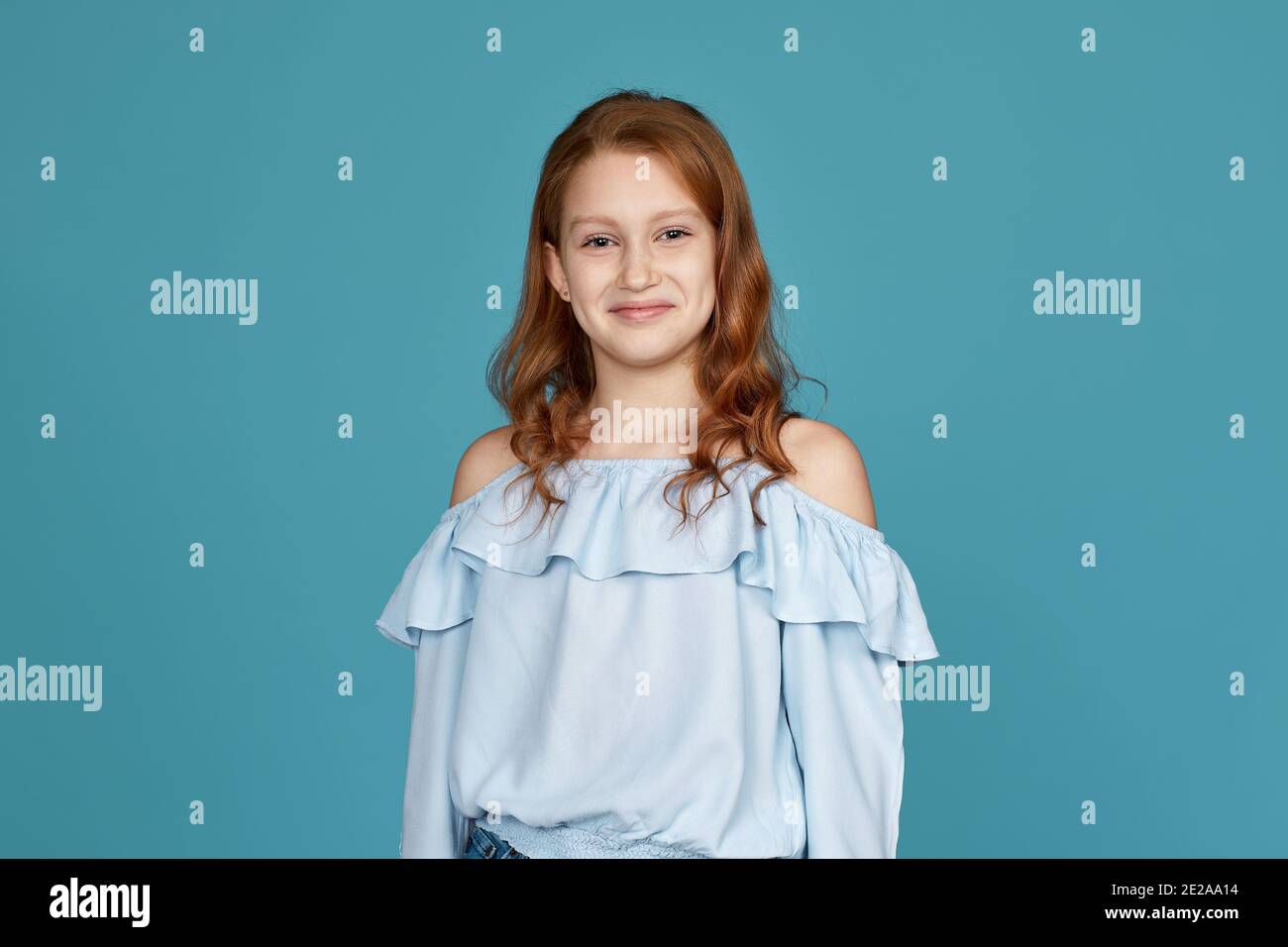 adorable redhead little child girl isolated on blue background Stock ...