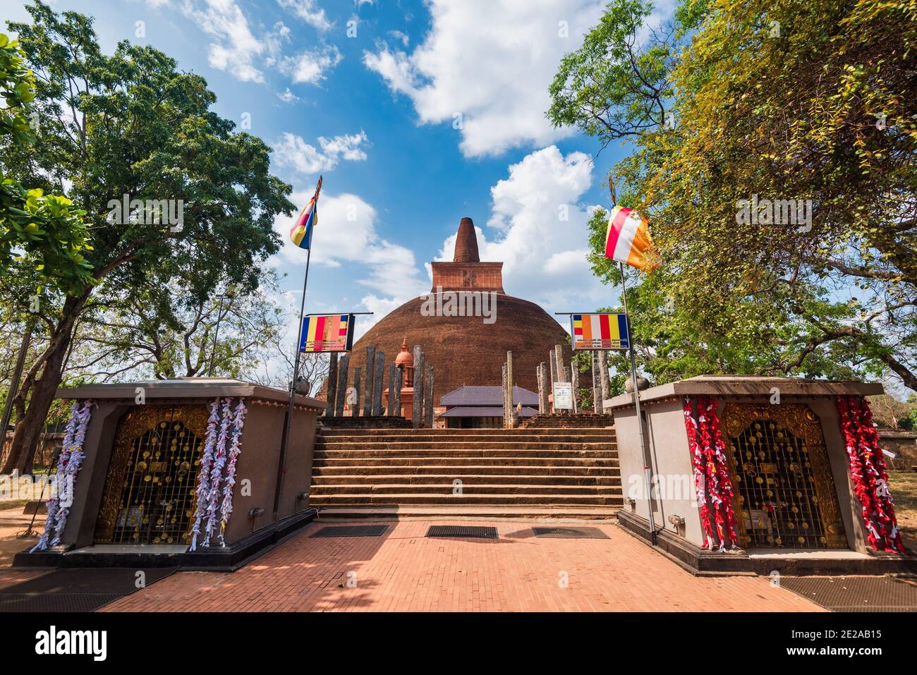 Pillars in front of the Giant red brick stupa of Abayagiri Monastery ...