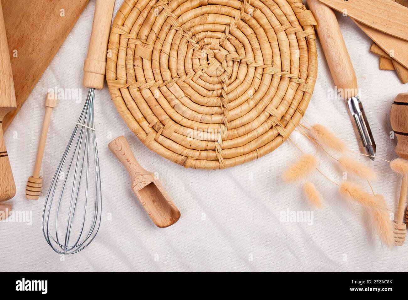 Flat lay with wooden kitchen utensils, cooking tools on textile ...