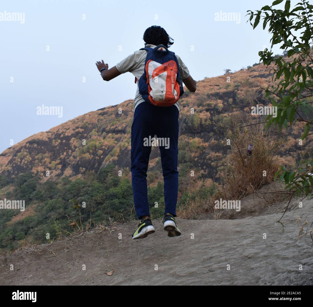 Back view of a tourist on the landscape Stock Photo - Alamy