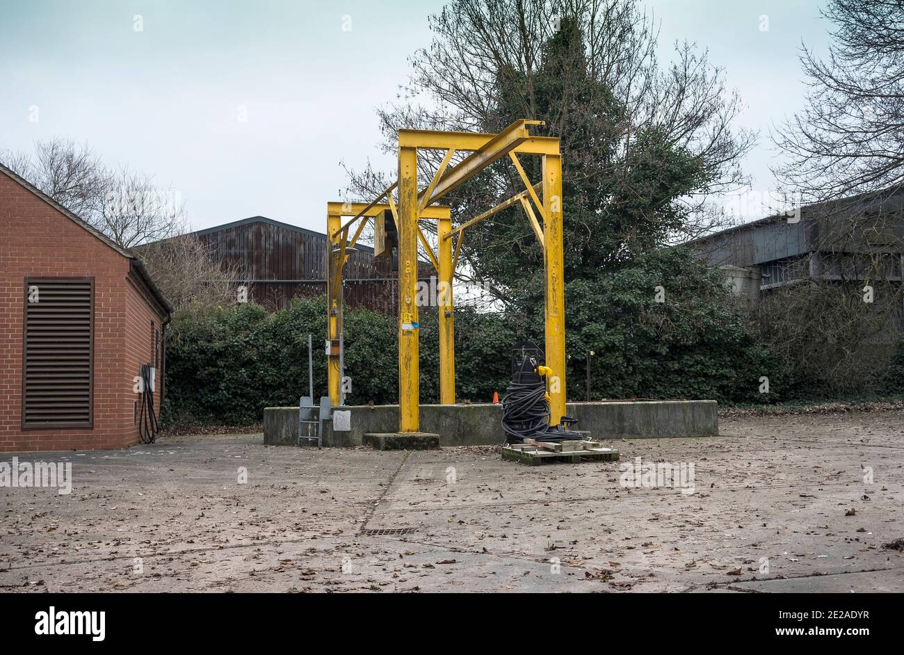 Yellow steel gantry hoist outdoors Stock Photo - Alamy