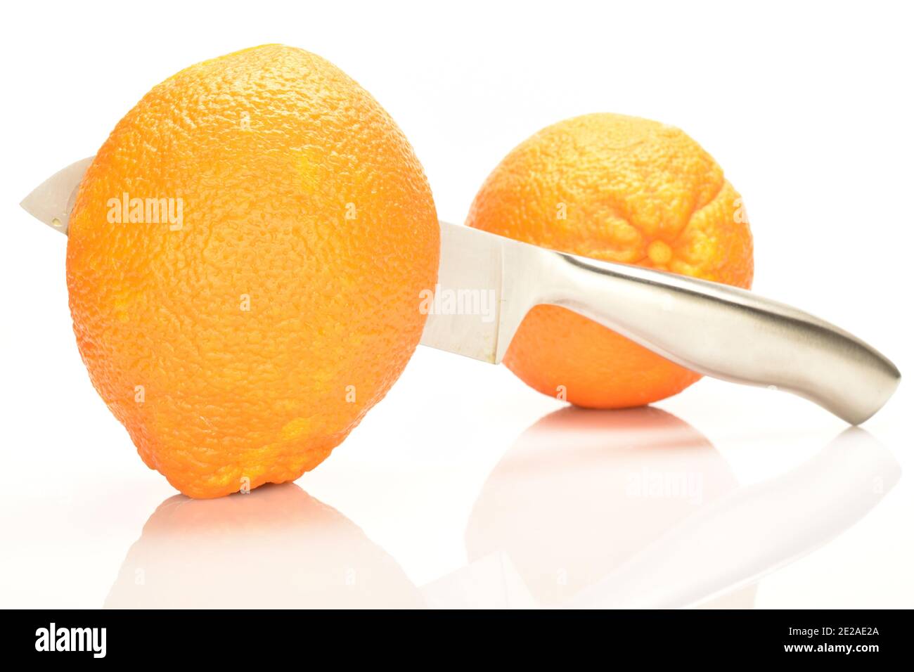 Two whole bright orange ripe aromatic oranges on a white background ...