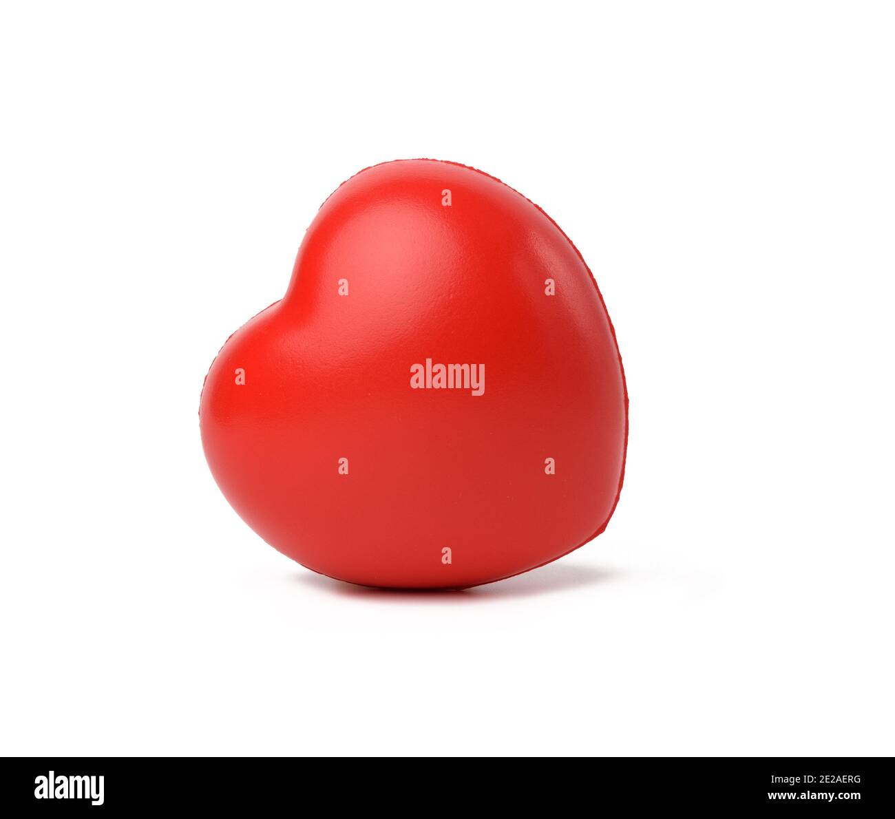 red rubber heart isolated on white background, close up Stock Photo - Alamy