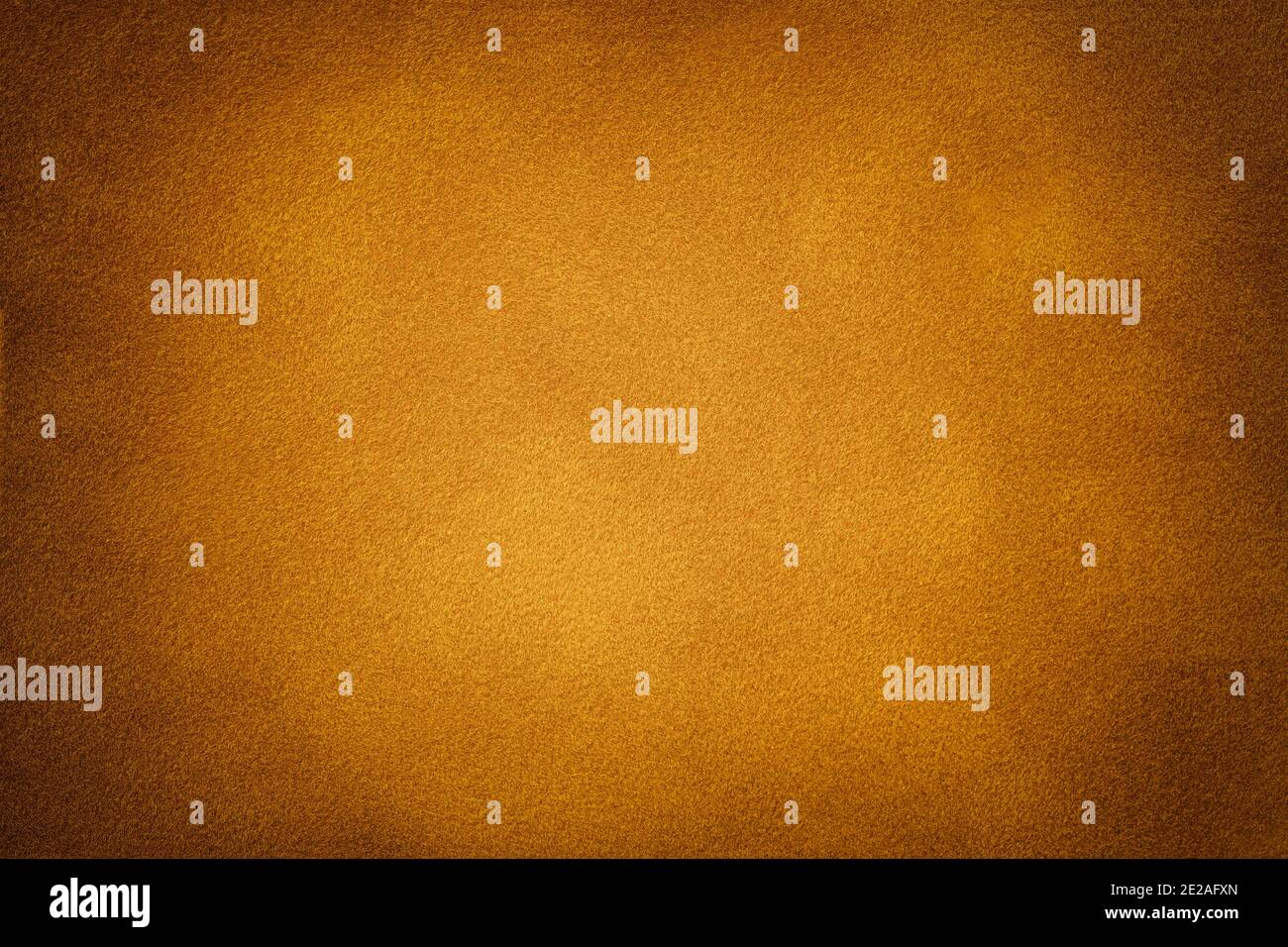 Dark orange matte background of suede fabric with vignette, closeup ...