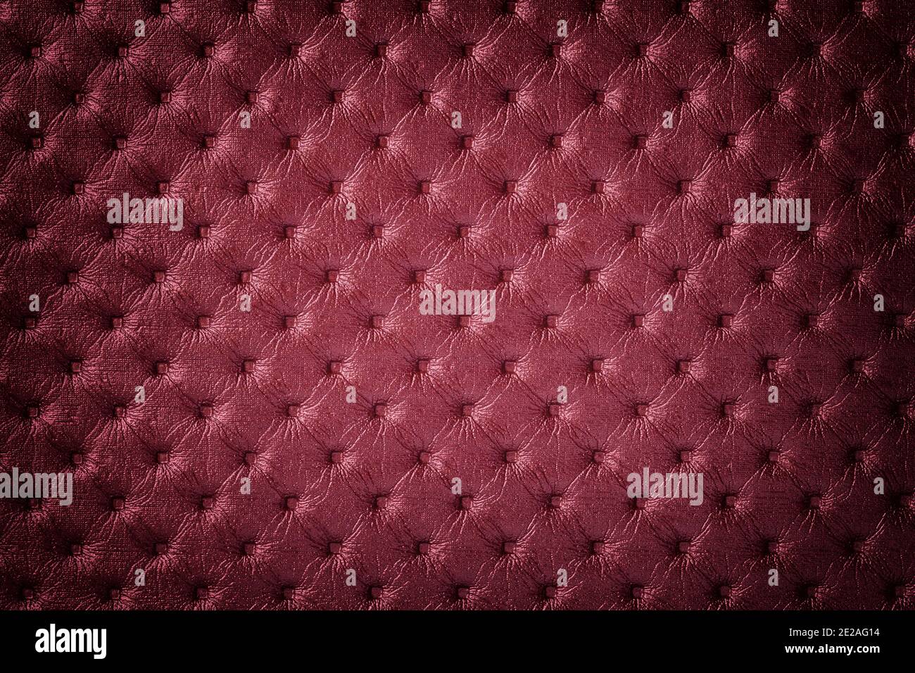 Texture of dark red leather background with capitone pattern, macro ...