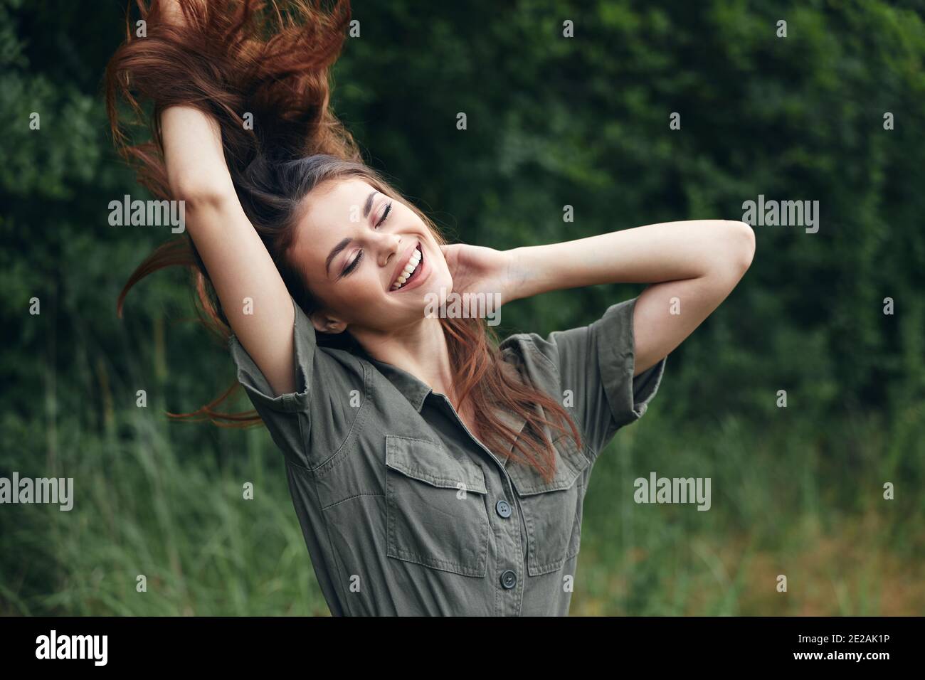 woman in the forest Fun smile closed eyes fresh air travel Stock Photo ...