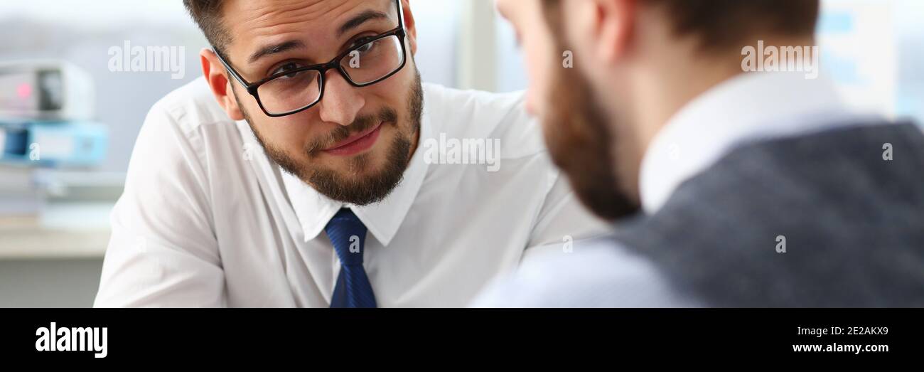 Two managers discussing work matters in office Stock Photo - Alamy
