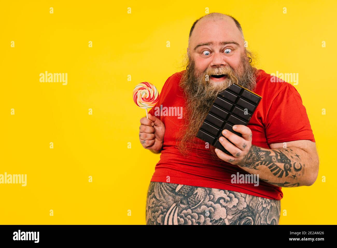 Man eating a chocolate tablet. Concept about food and lifestyle Stock ...