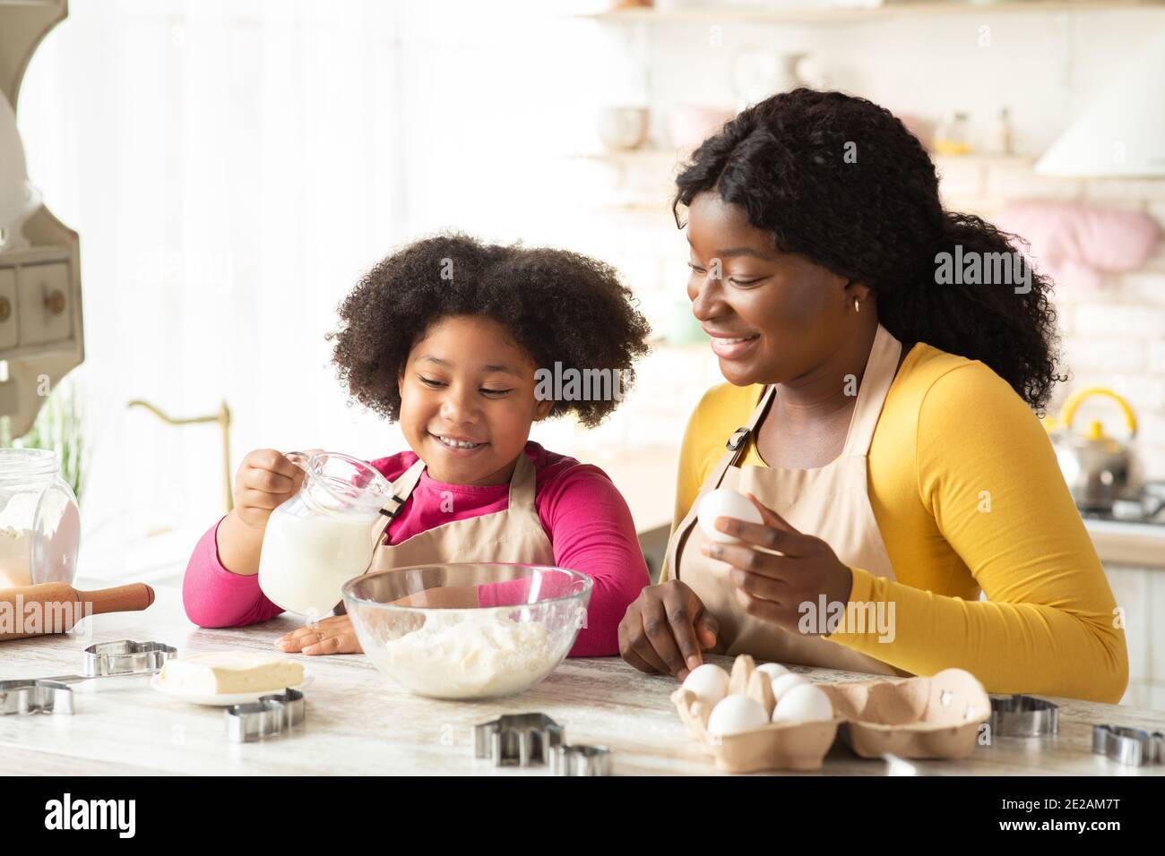 Cheerful Black Family Mother And Daughter Baking Together In Kitchen ...