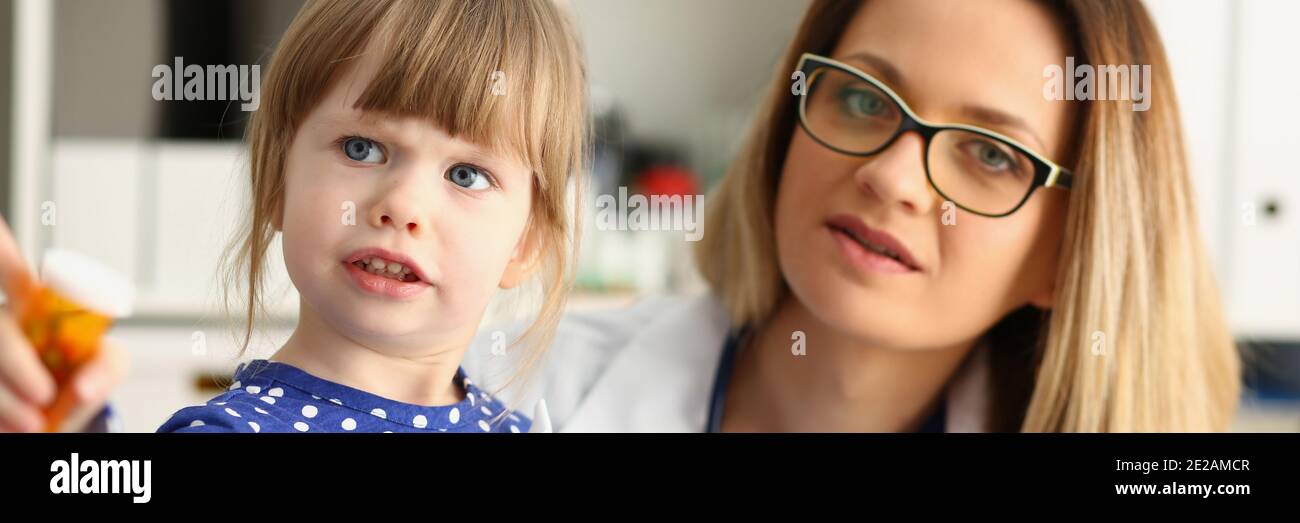 Little child in office being checked up by doctor Stock Photo - Alamy