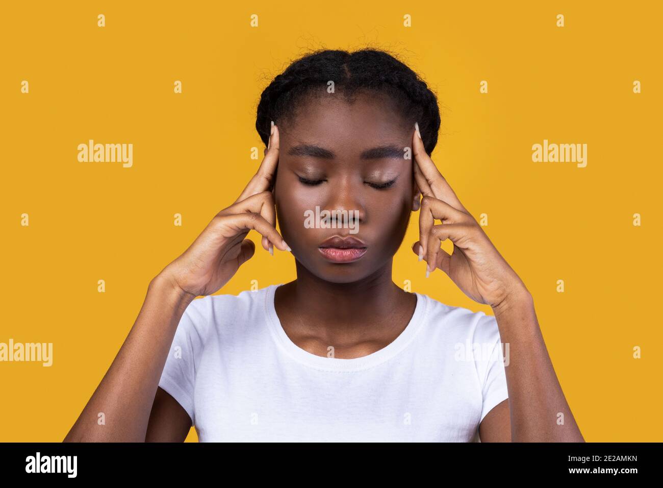 Woman with eyes closed thinking hard hi-res stock photography and ...