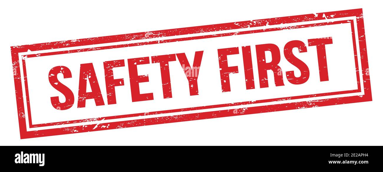 SAFETY FIRST text on red grungy vintage rectangle stamp Stock Photo - Alamy