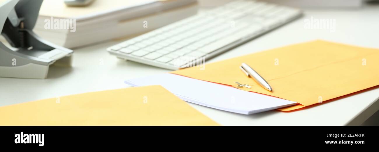 Manager working place with papers and computer Stock Photo - Alamy