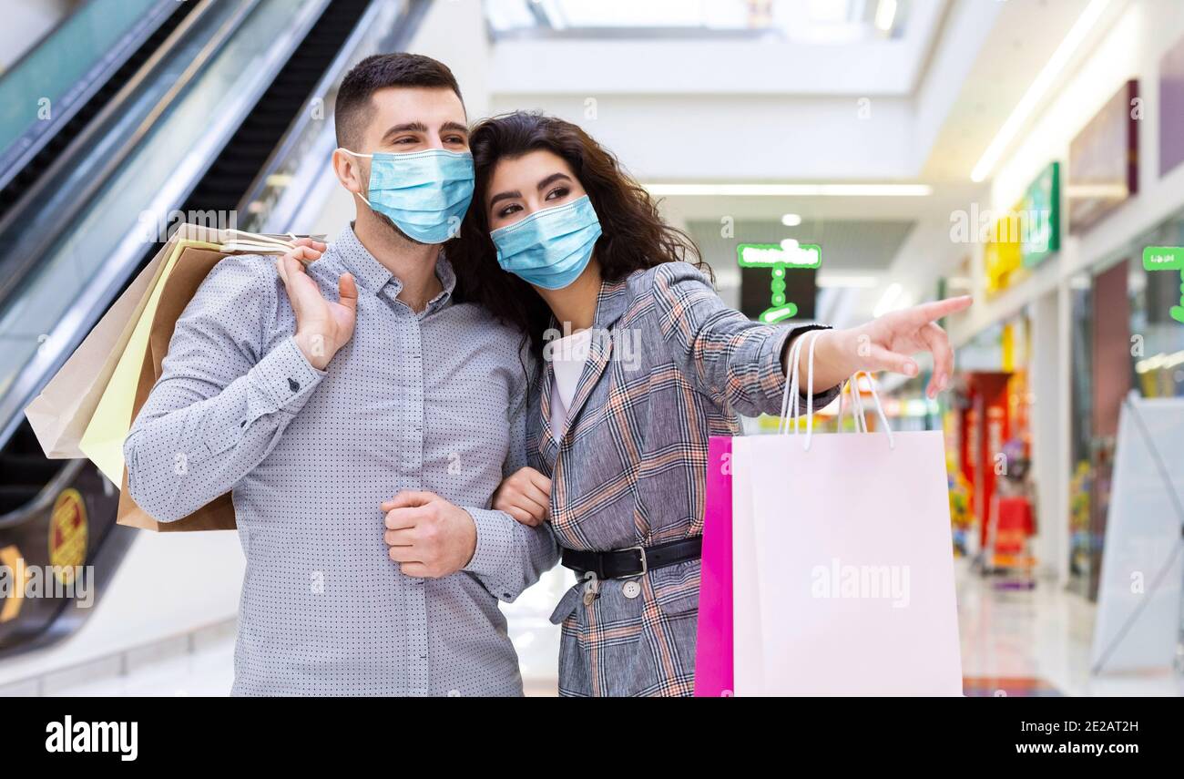 Young couple protective face masks hi-res stock photography and images ...