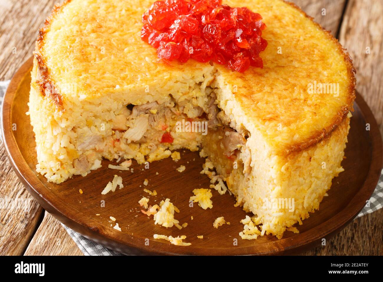 Tahchin Crispy Saffron Rice Casserole Stuffed With Chicken closeup in ...