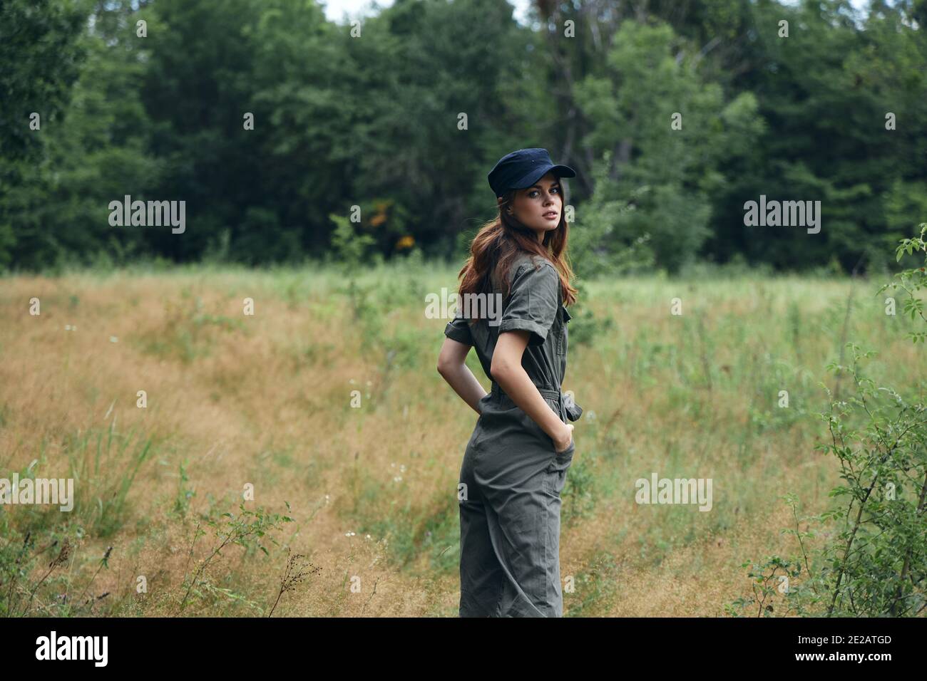Woman in overalls walking field hi-res stock photography and images - Alamy