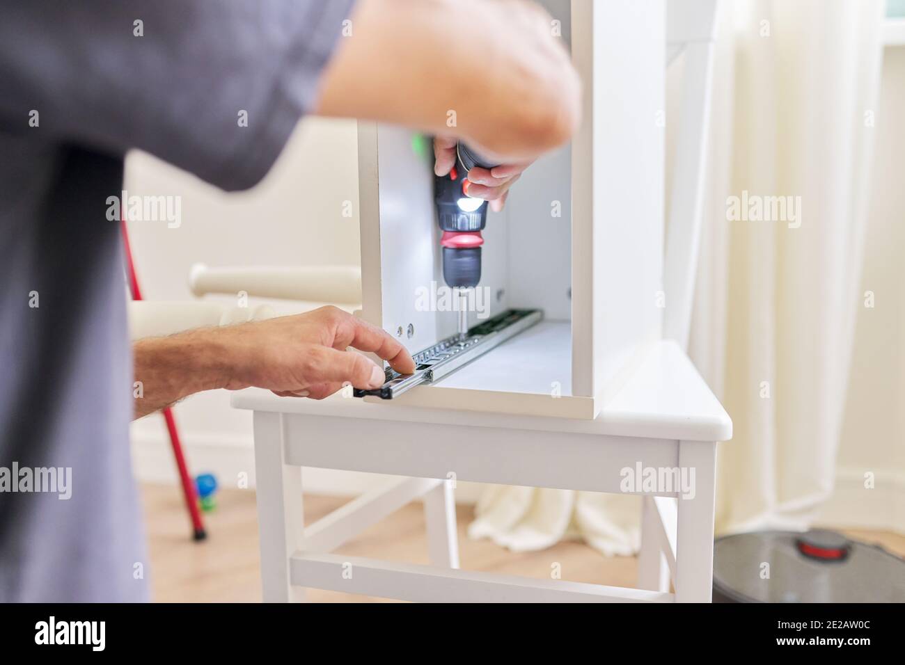 Close up detail of furniture and hands of carpenter worker with ...