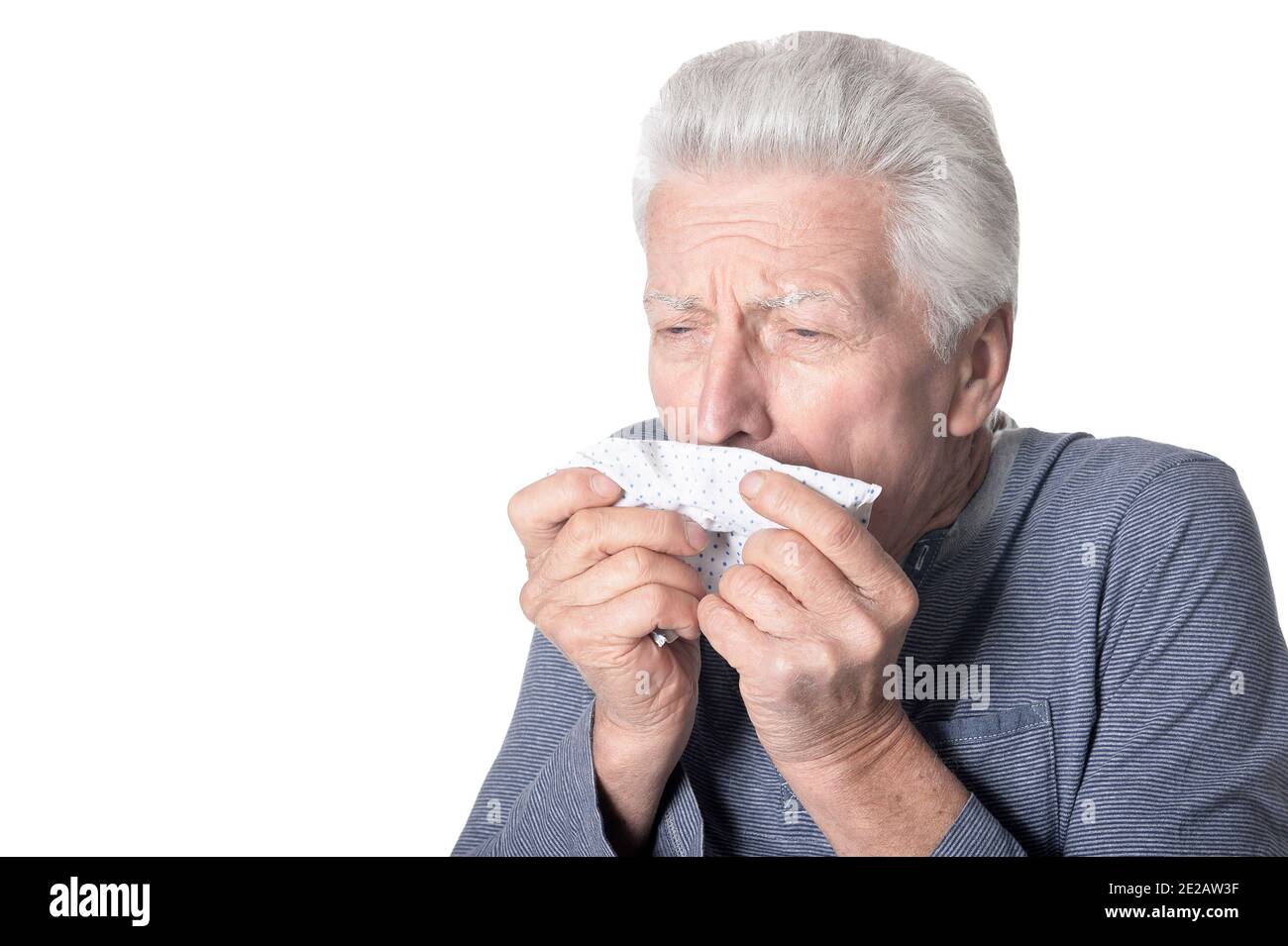 Sick old man standing on white background Stock Photo - Alamy