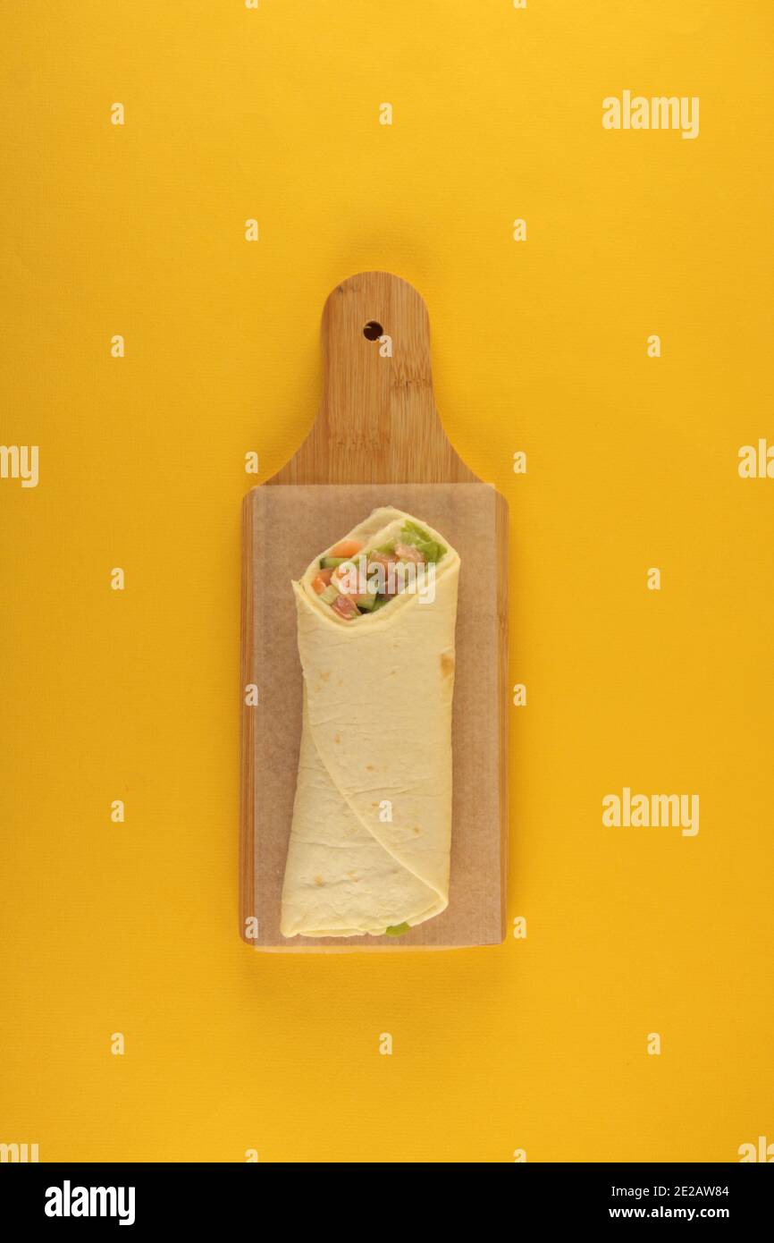 traditional turkish food doner kebab on wooden cutting board against ...