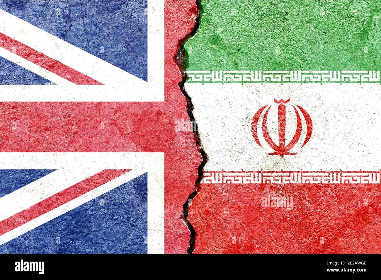 View of UK VS Iran national flags isolated on broken cracked concrete ...