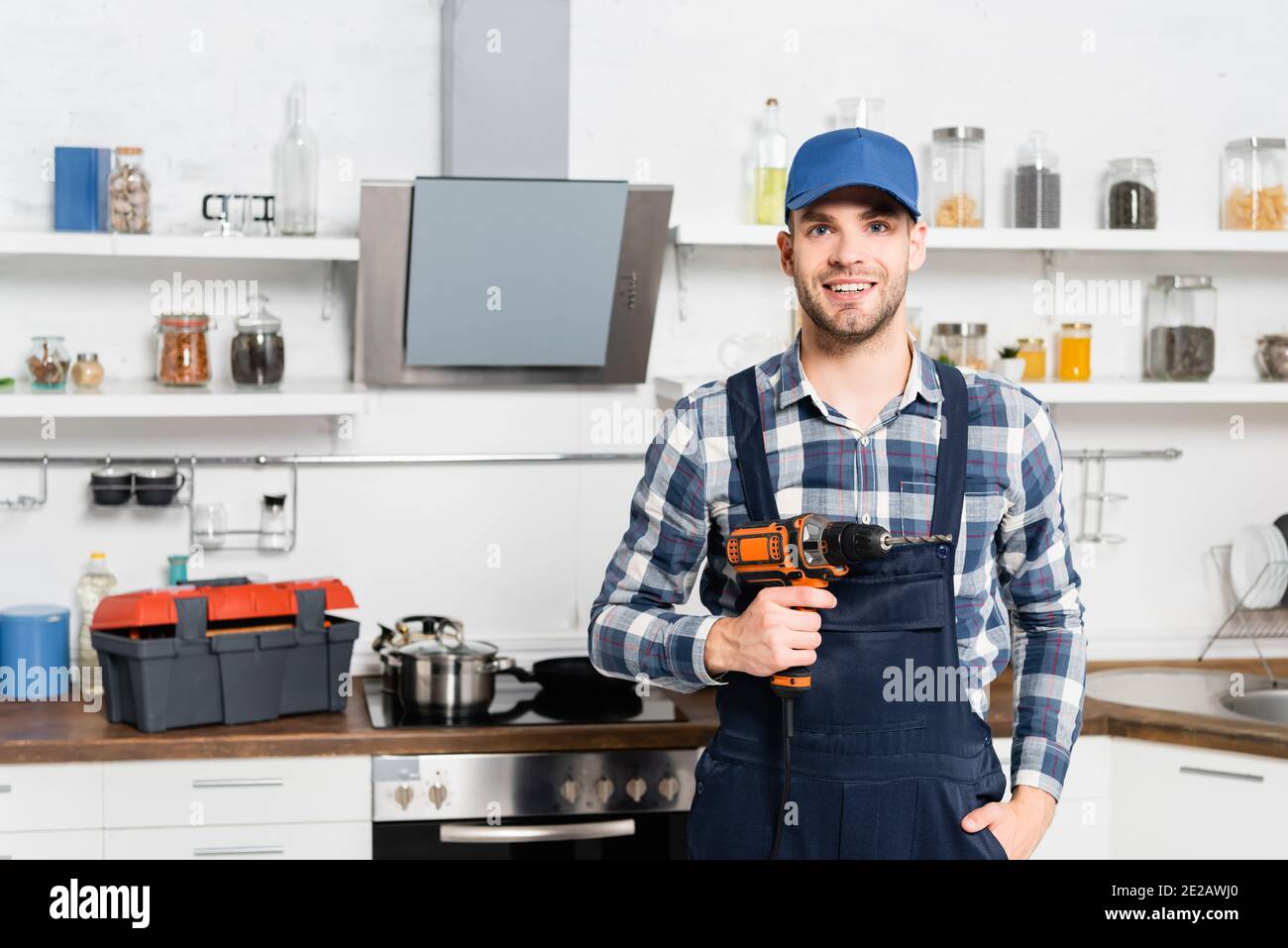 Man with toolbox and drill hi-res stock photography and images - Alamy