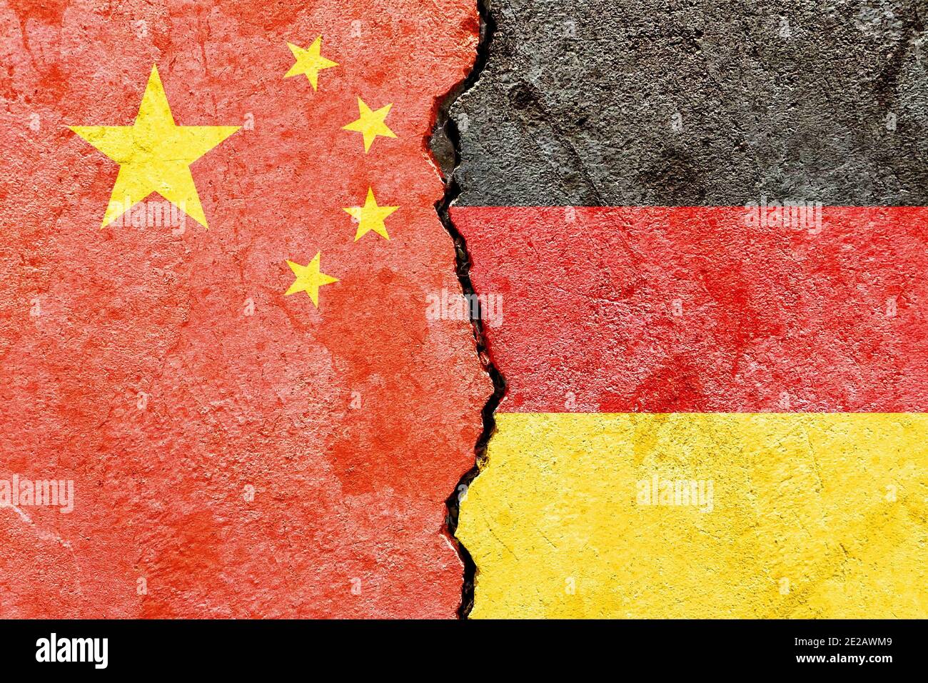 View of China VS Germany national flags isolated on broken cracked ...