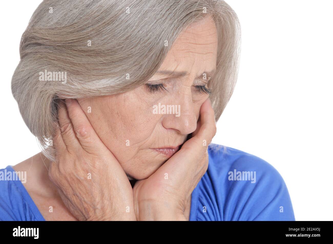Sad senior woman posing isolated on white background Stock Photo - Alamy