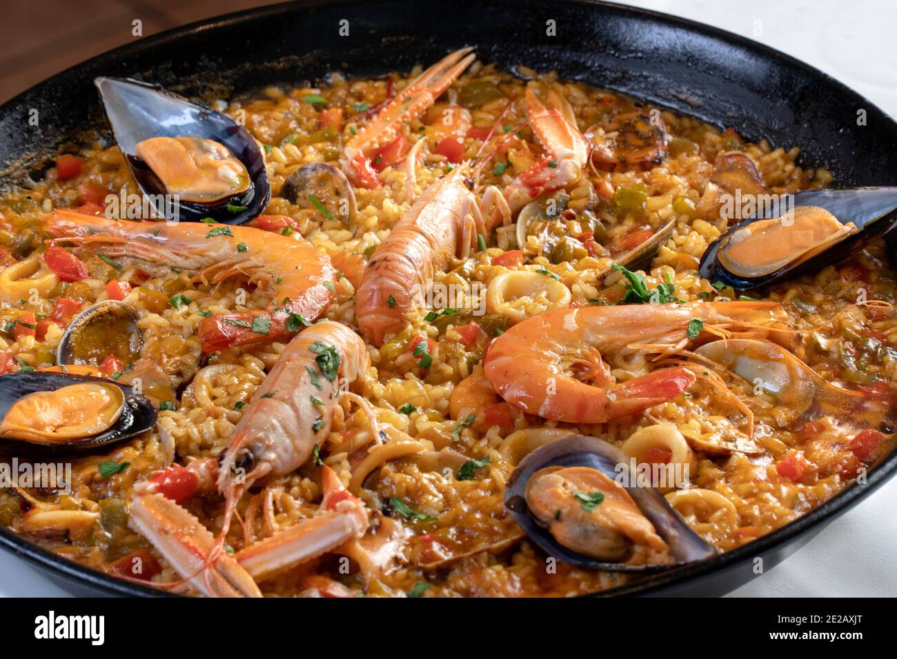 Spanish seafood Paella ,with crayfish, squid, mussel and prawn, in an ...