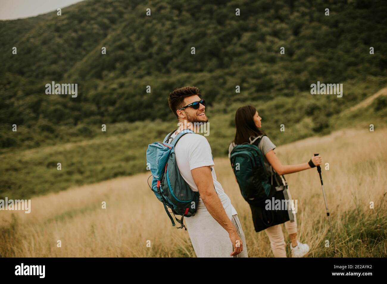 Happy young couple backpacking hi-res stock photography and images - Alamy