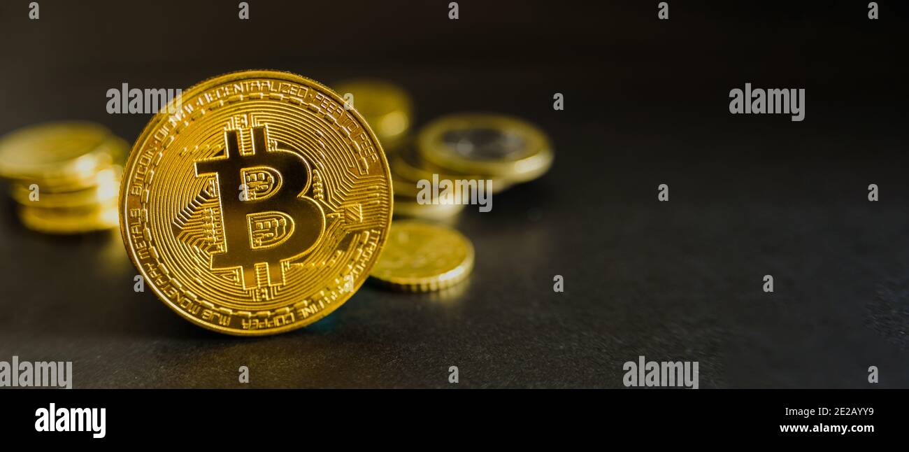 Bitcoin with other coins on black background - banner, wide format ...