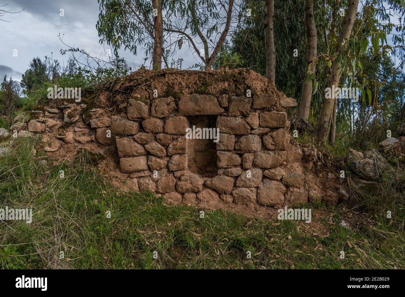 Closeup of a small stone hut in a scenic woody terrain Stock Photo - Alamy