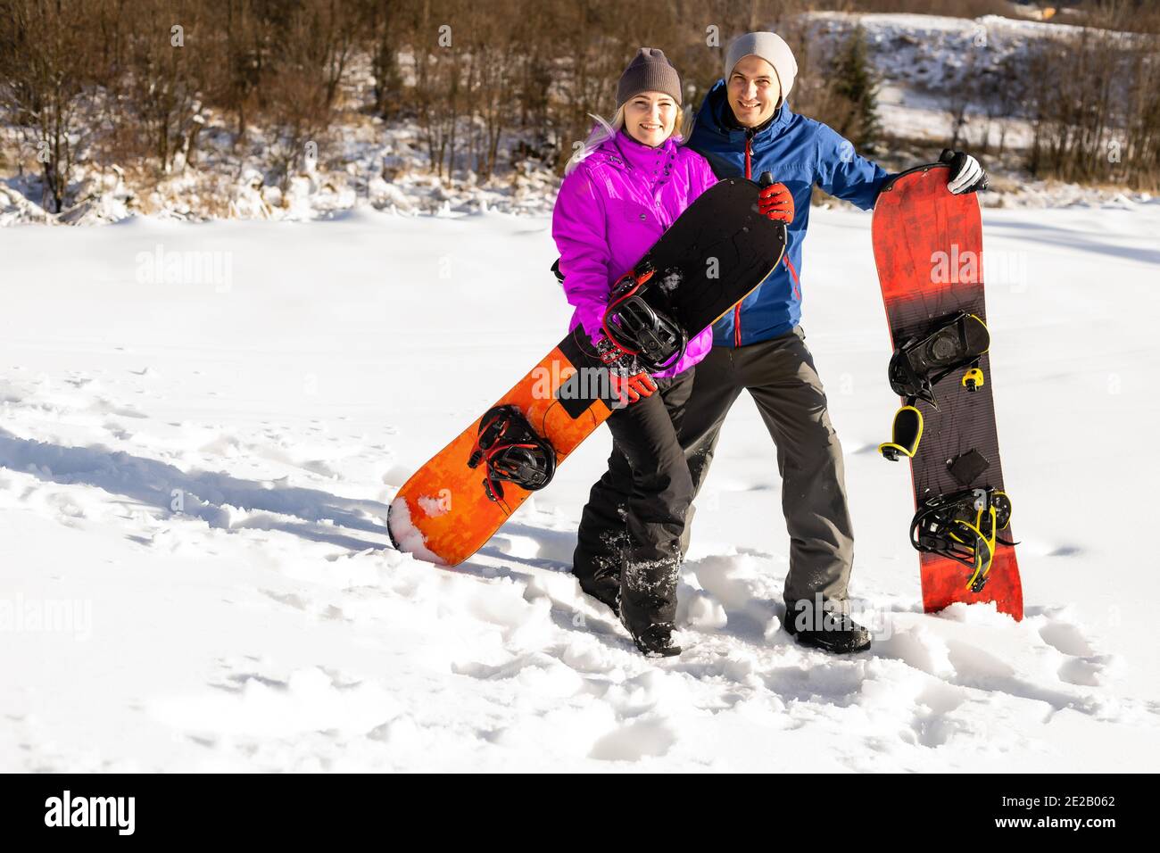 family with snowboards at winter resort Stock Photo - Alamy