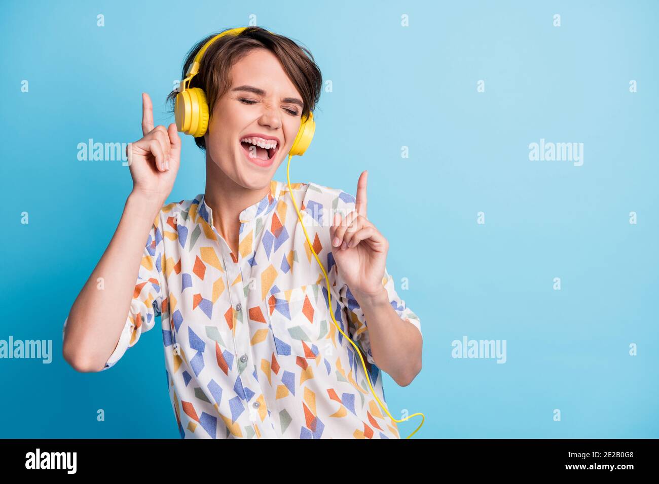 Photo of happy funky charming young lady dance listen music headset ...