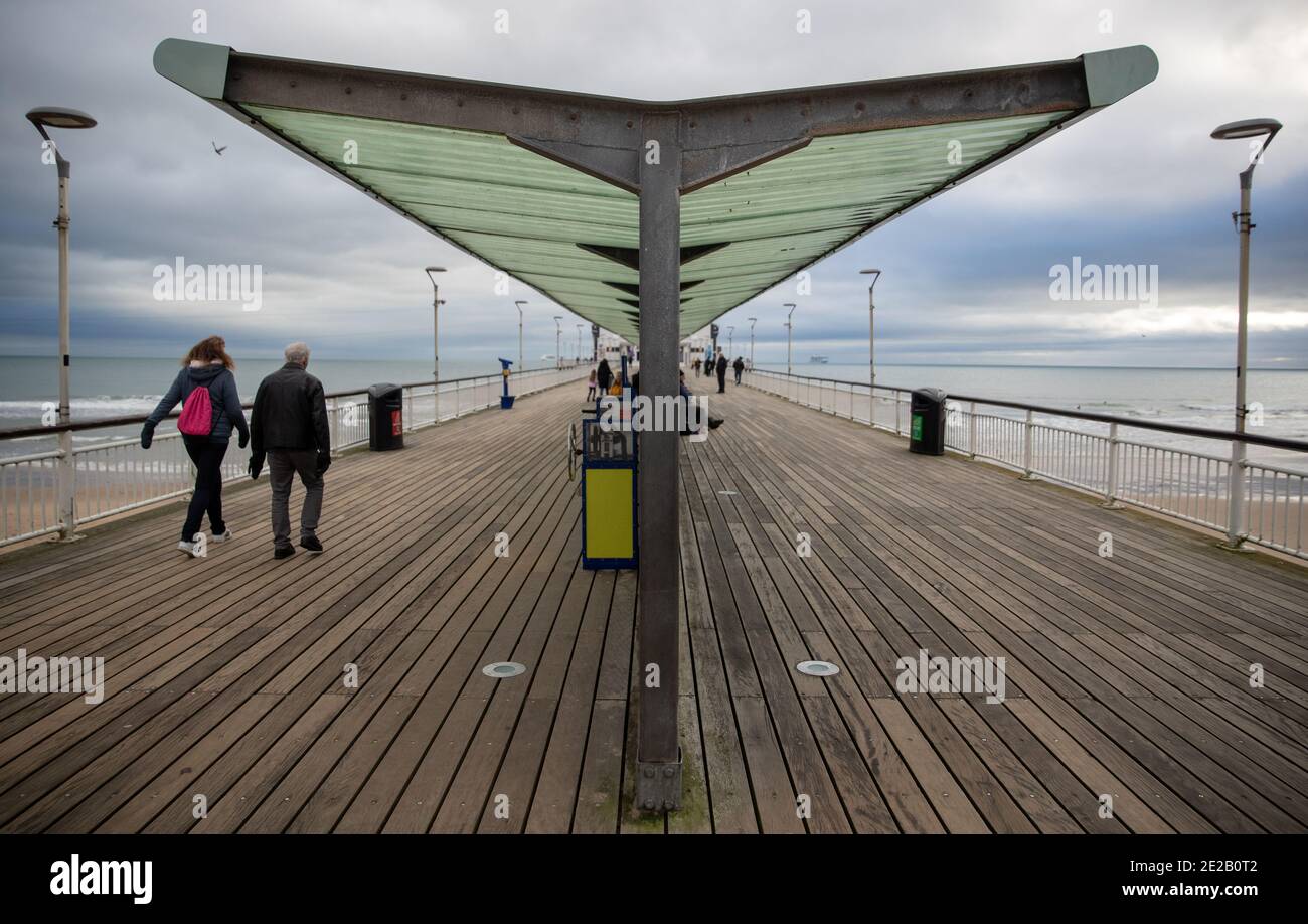 People walk along Bournemouth pier in Drset Stock Photo - Alamy
