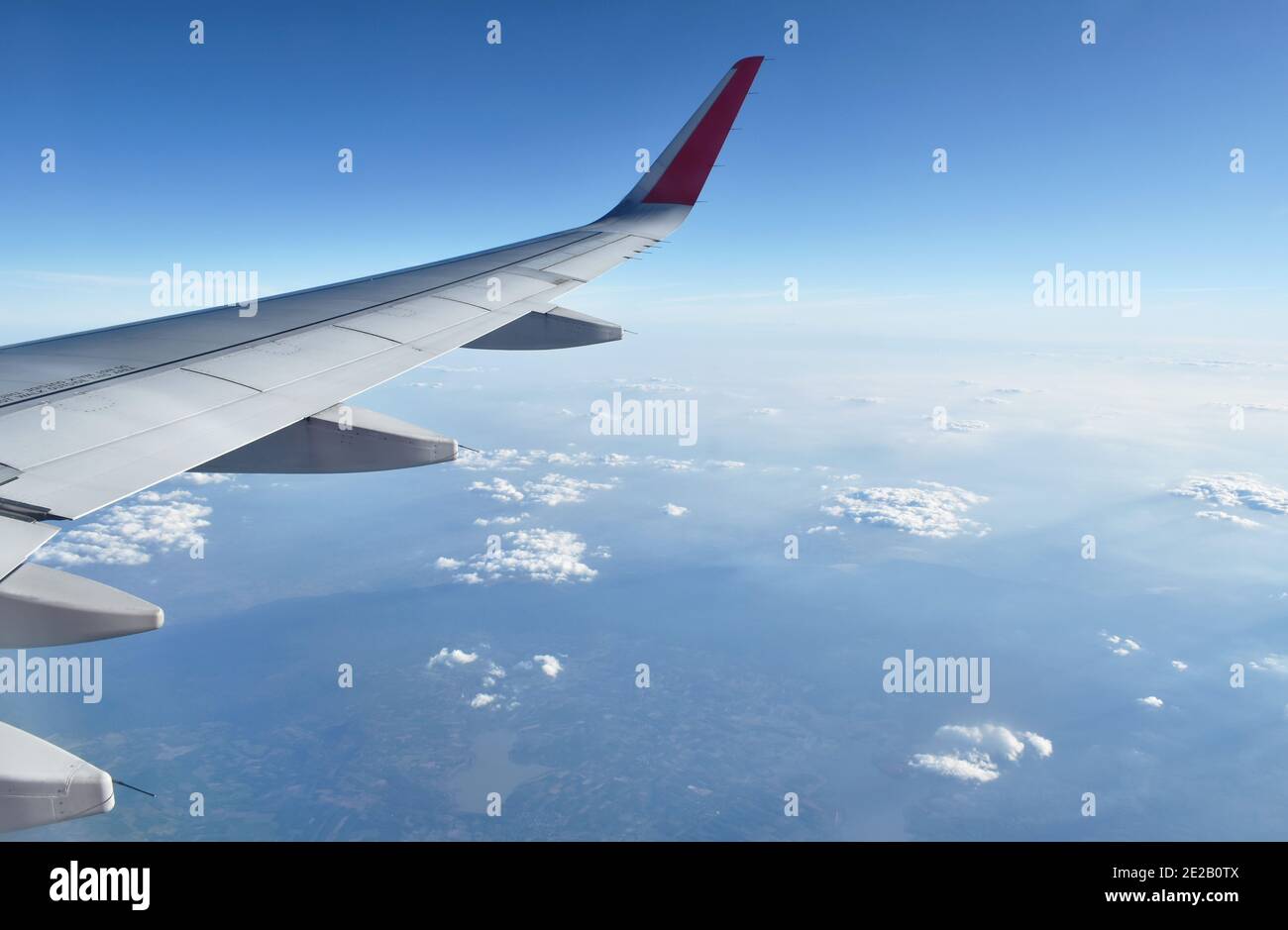 plane wing and cloud floating on sky through window frame Stock Photo ...