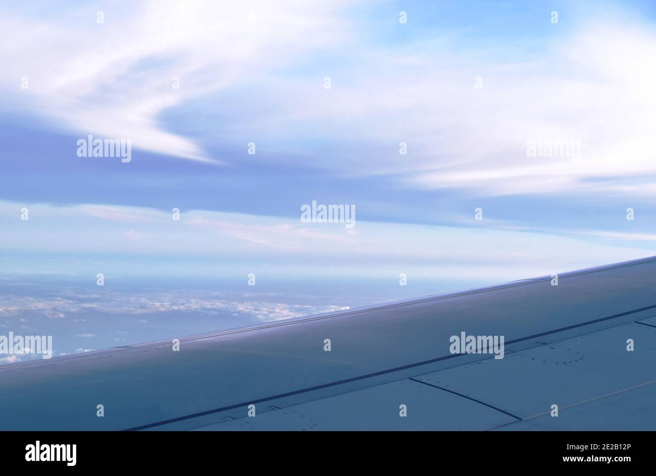 plane wing and cloud floating on sky through window frame Stock Photo ...