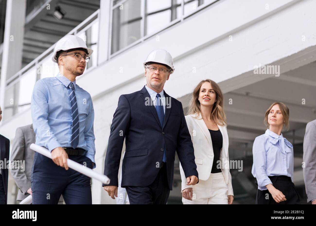 Business team in helmets hi-res stock photography and images - Alamy