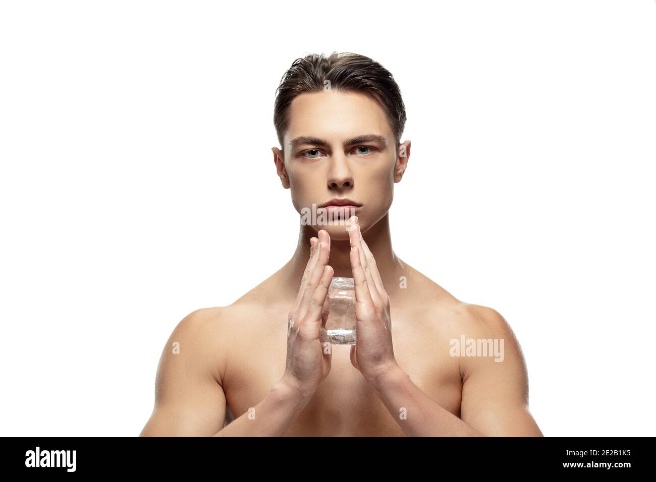 Lines. Portrait of young man isolated on white studio background ...