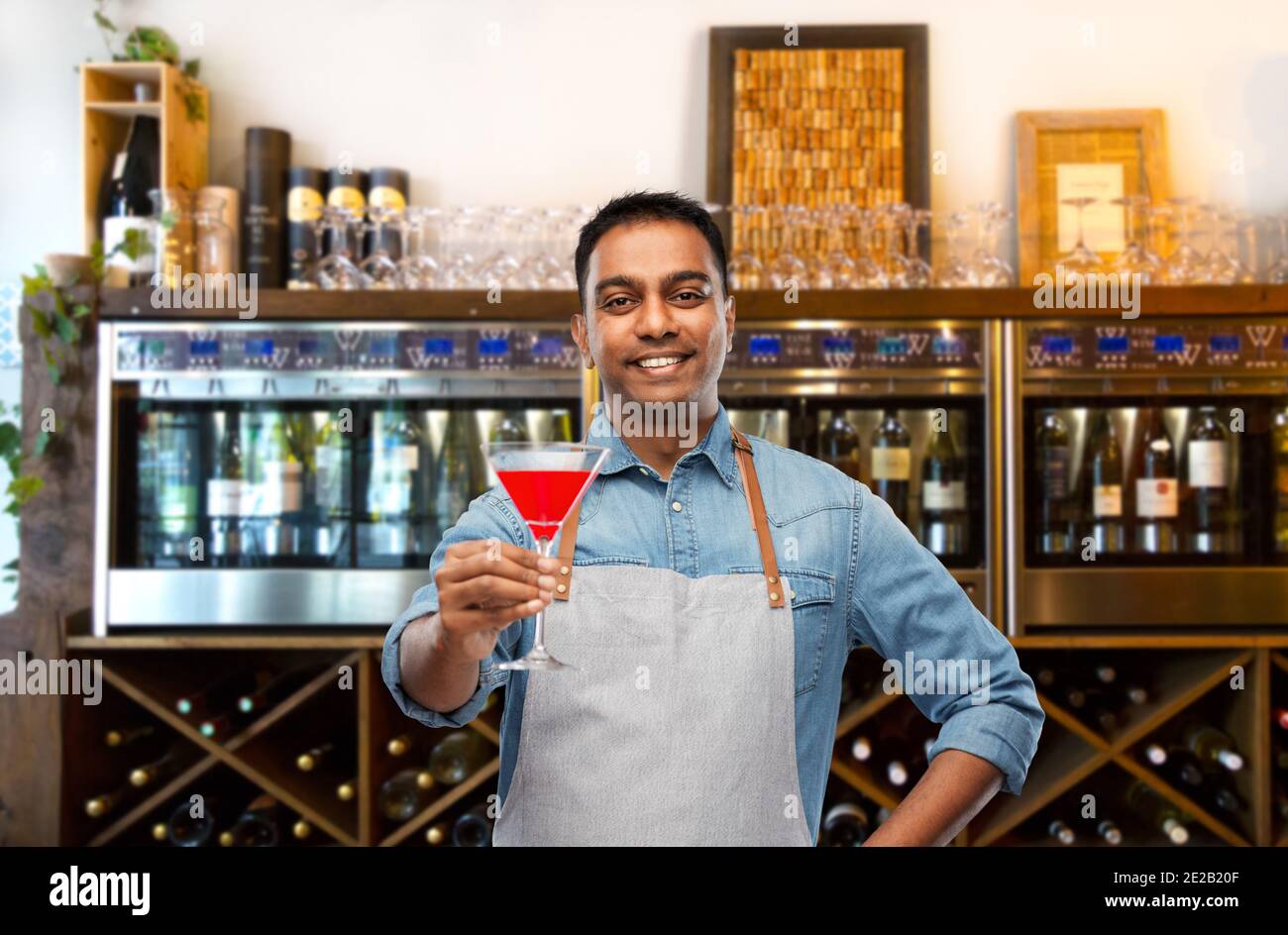 Barman holding small glass hi-res stock photography and images - Alamy
