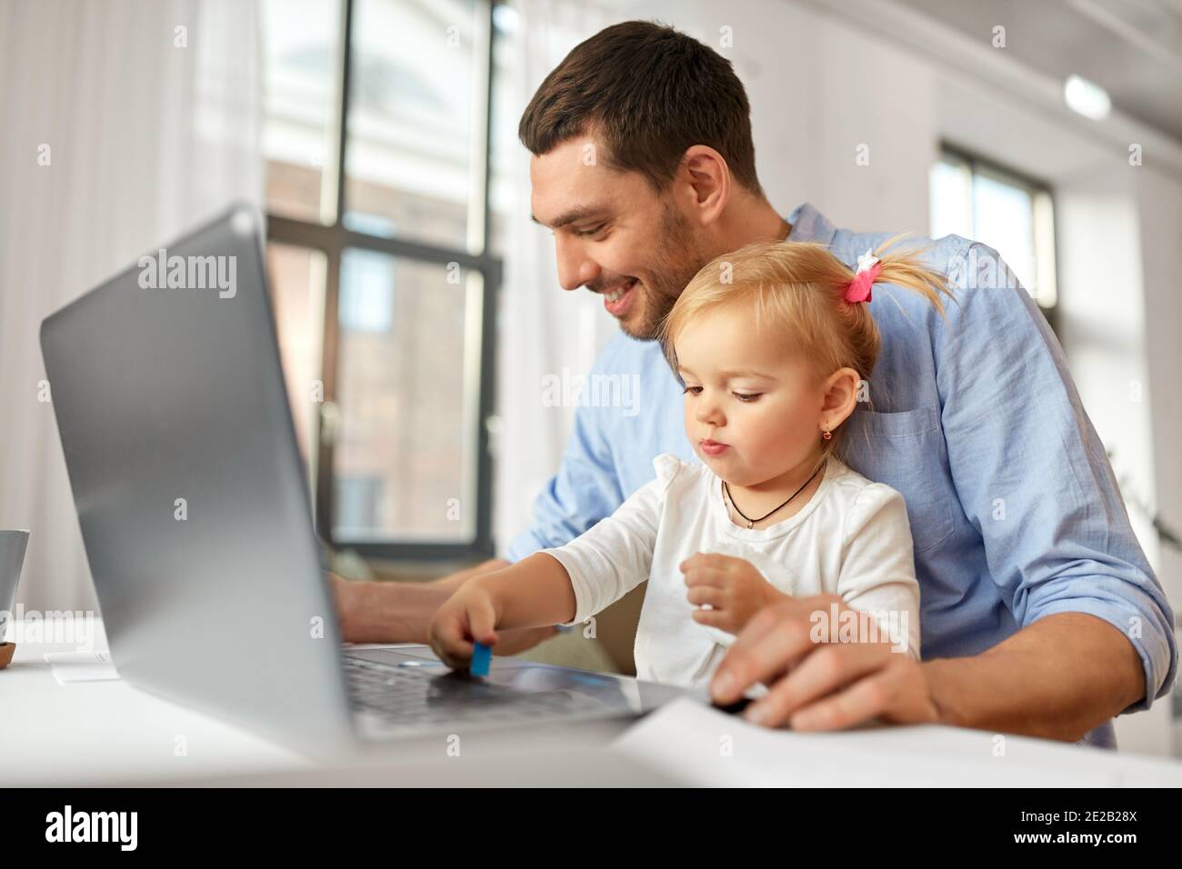 Busy Father Working Laptop High Resolution Stock Photography and Images ...