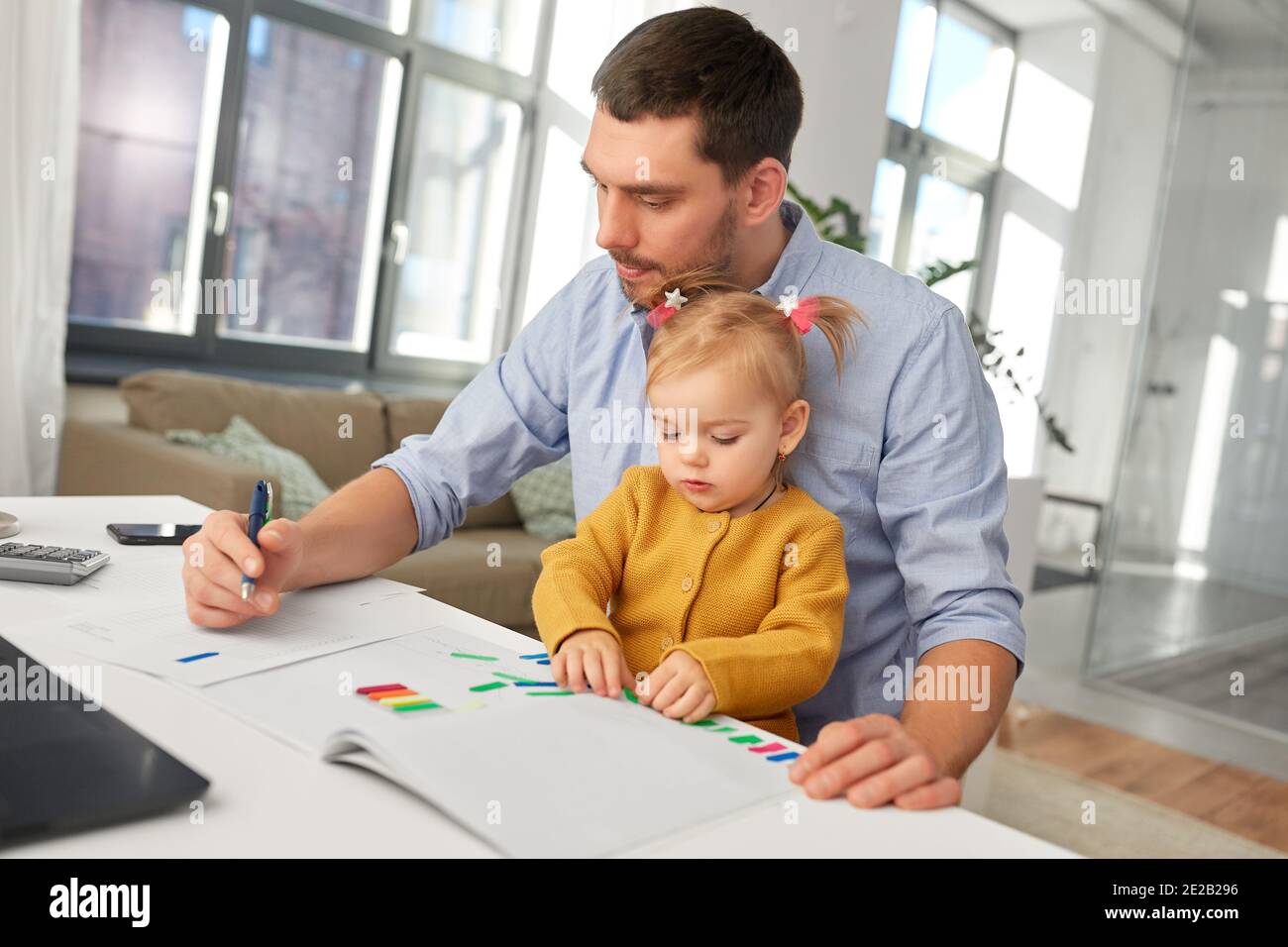 working father with baby daughter at home office Stock Photo - Alamy