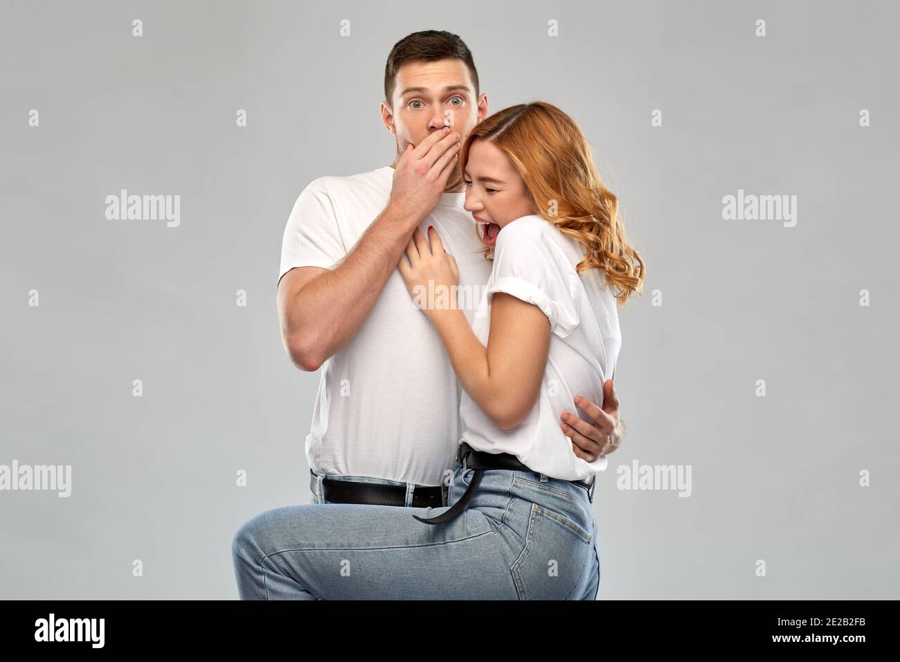 Woman scared hugging man hi-res stock photography and images - Alamy