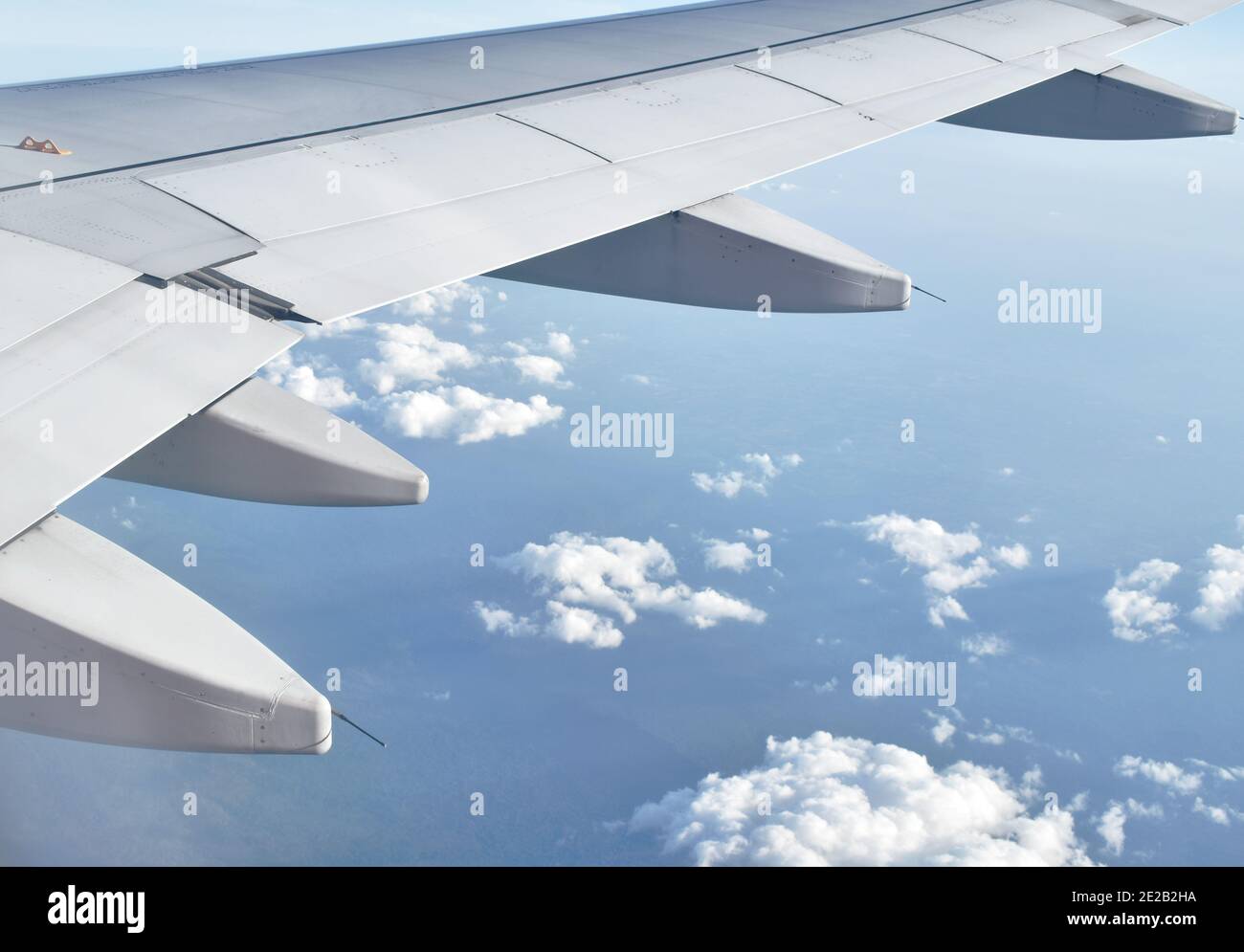 plane wing and cloud floating on sky through window frame Stock Photo ...