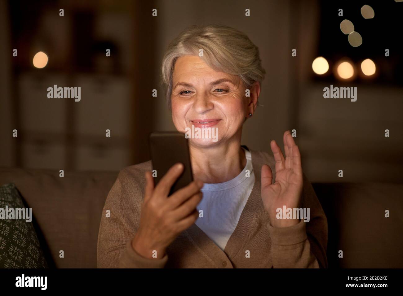 happy old woman with smartphone having video call Stock Photo - Alamy