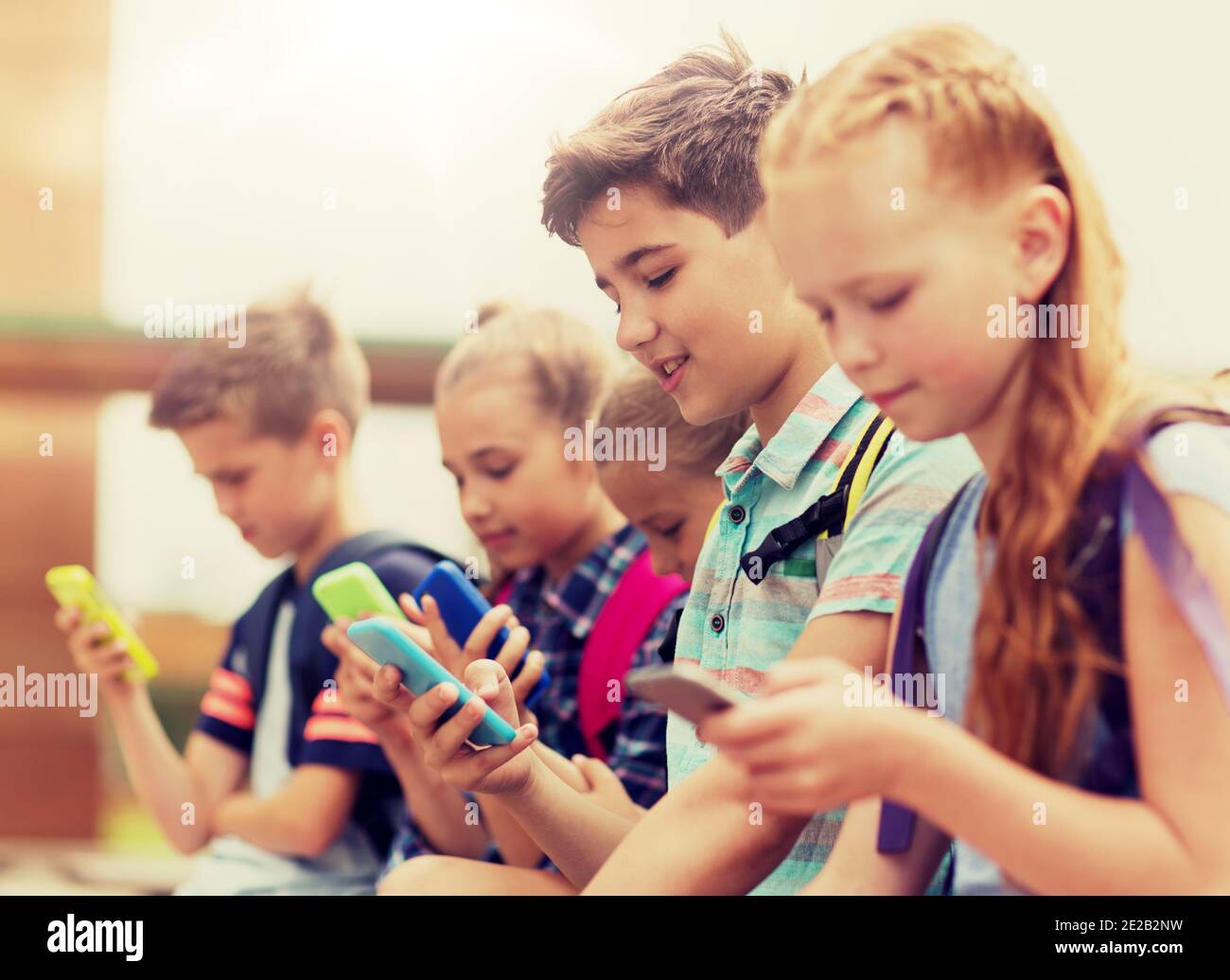 Elementary school students smartphones hi-res stock photography and ...