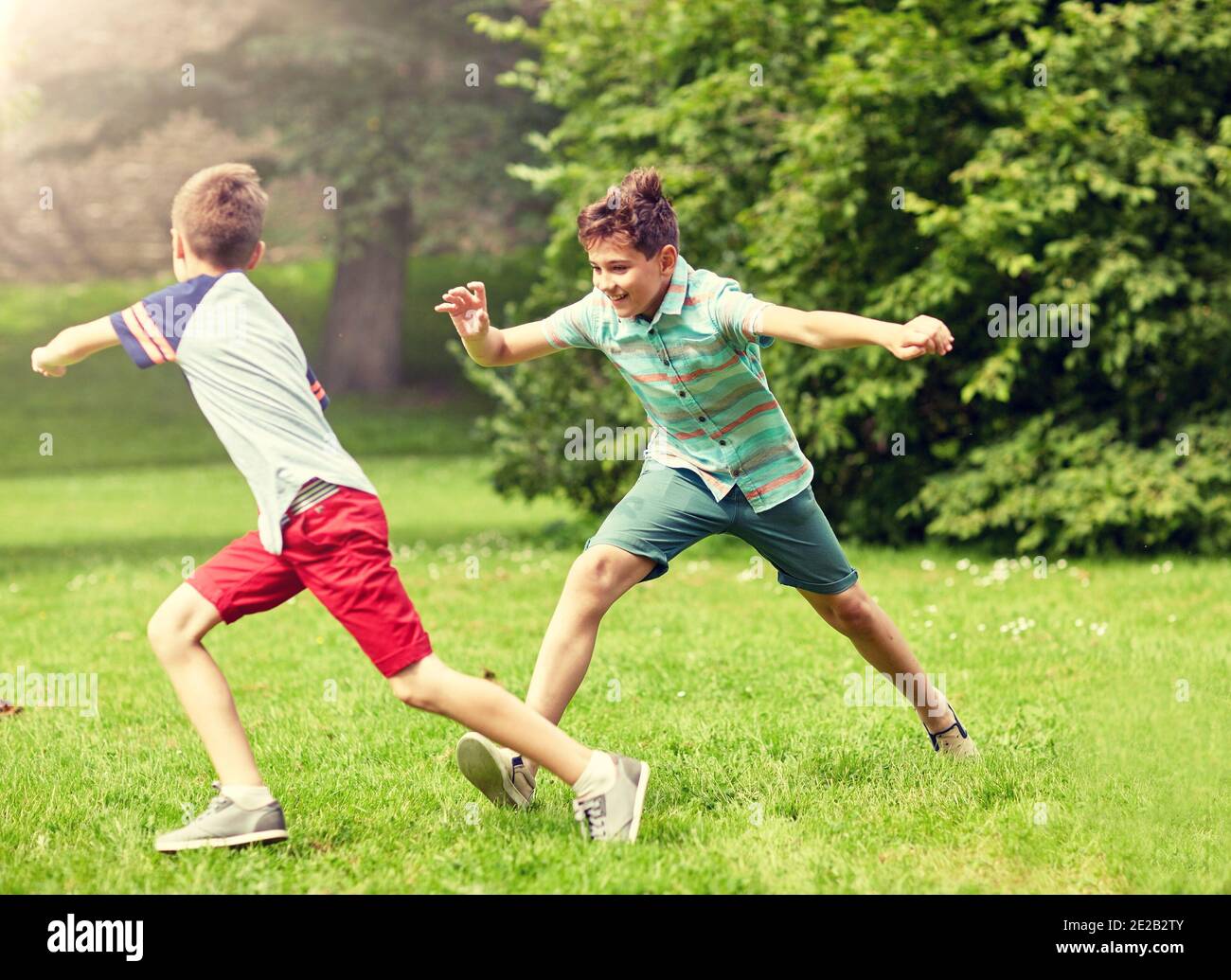 happy kids running and playing game outdoors Stock Photo - Alamy