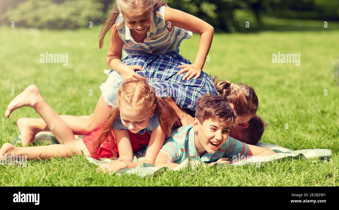 happy kids playing and having fun in summer park Stock Photo - Alamy