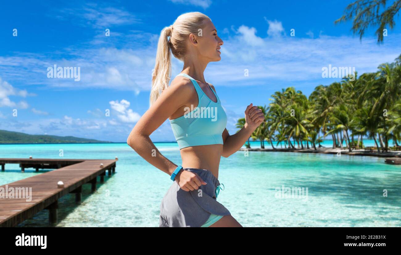 Fitness woman running tropical hi-res stock photography and images - Alamy